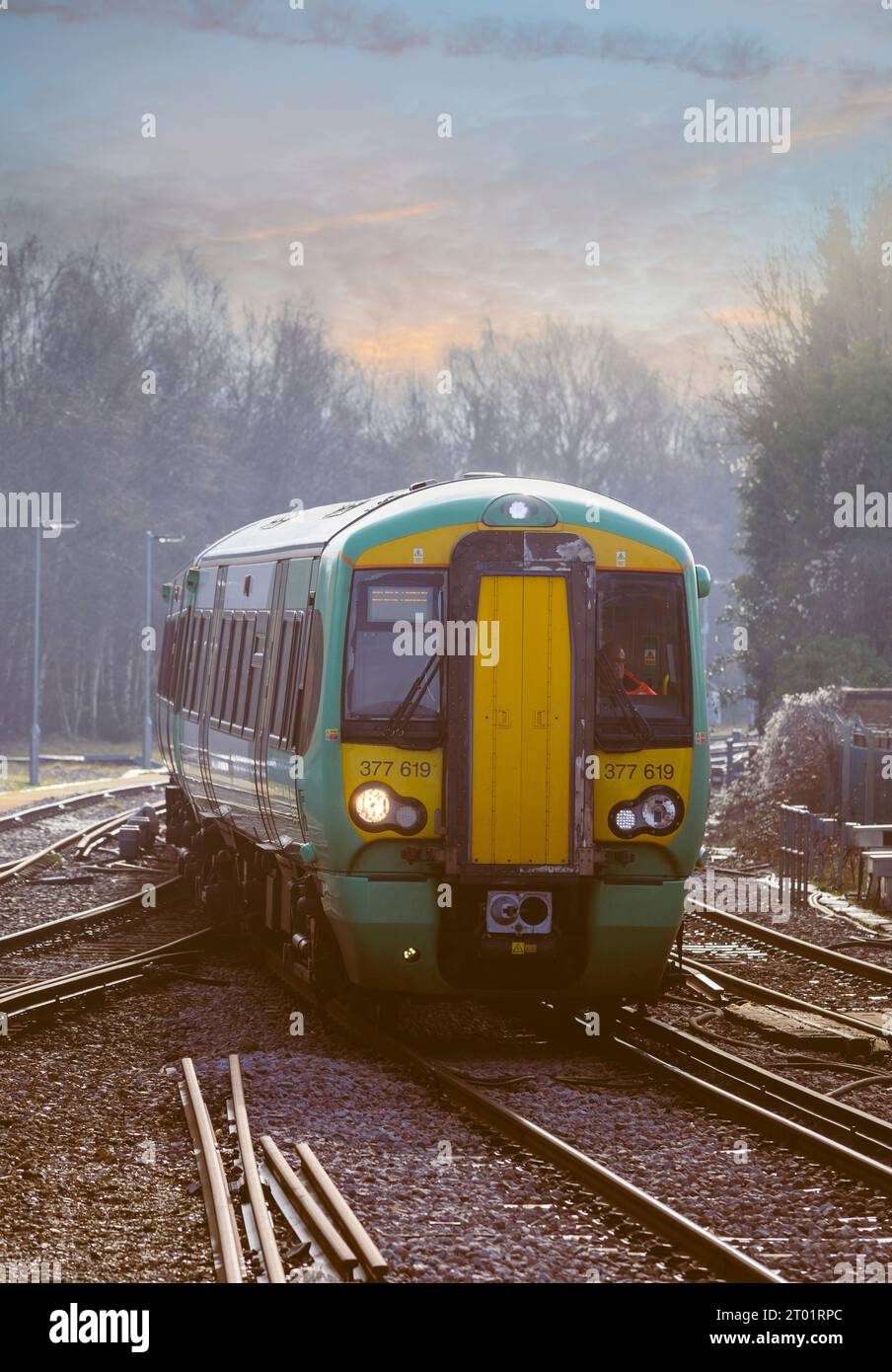 Southern class 377 passenger train approaching Tattenham Corner Railway Station, Surrey, England ...