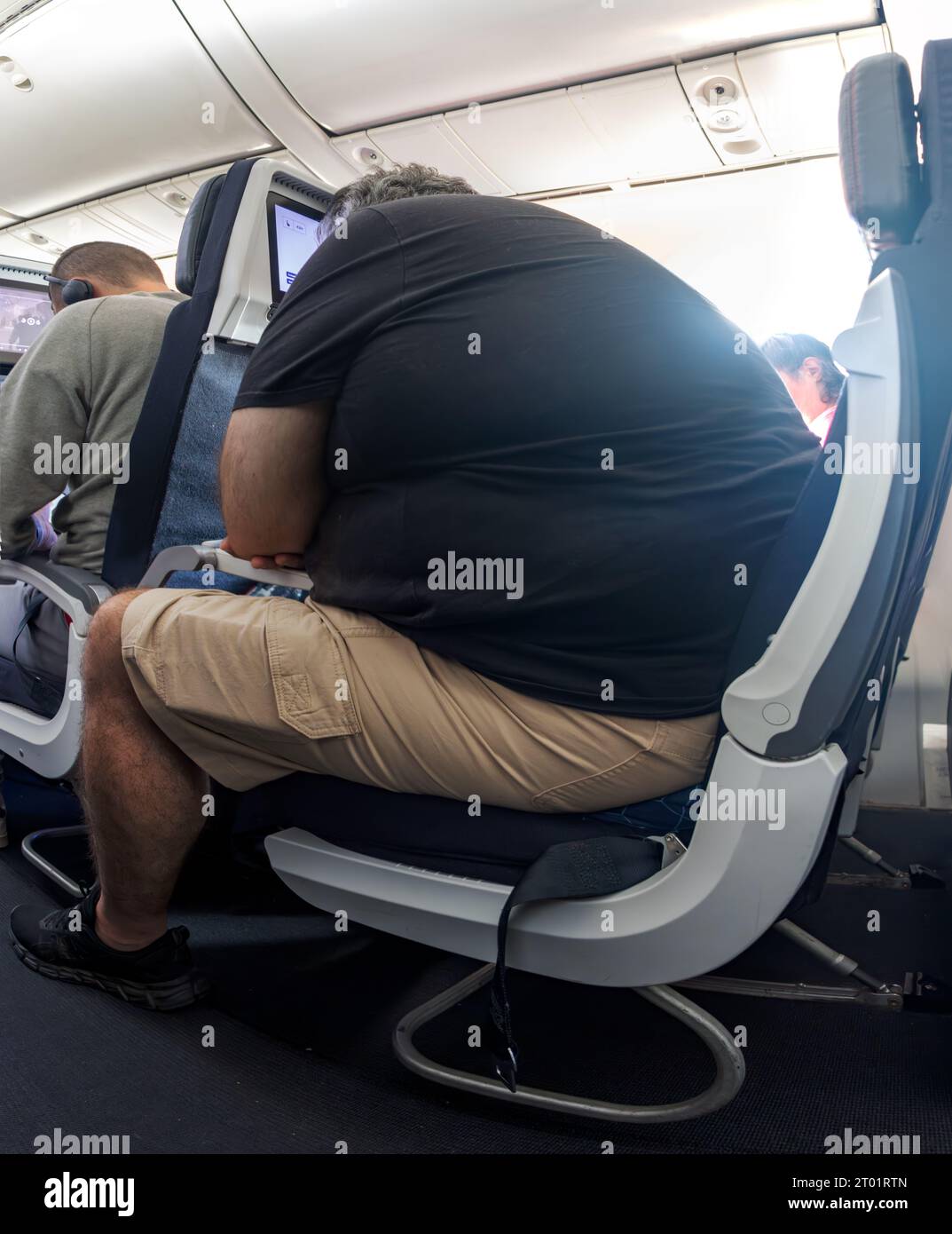 Overweight plane passenger hi-res stock photography and images - Alamy
