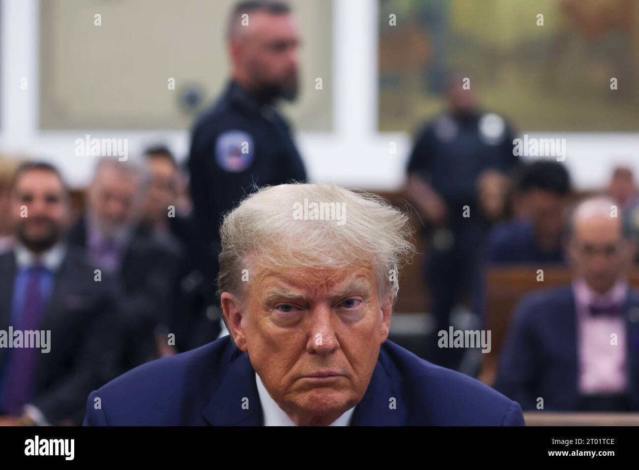 Former President Donald Trump sits in court for a civil fraud case at a ...