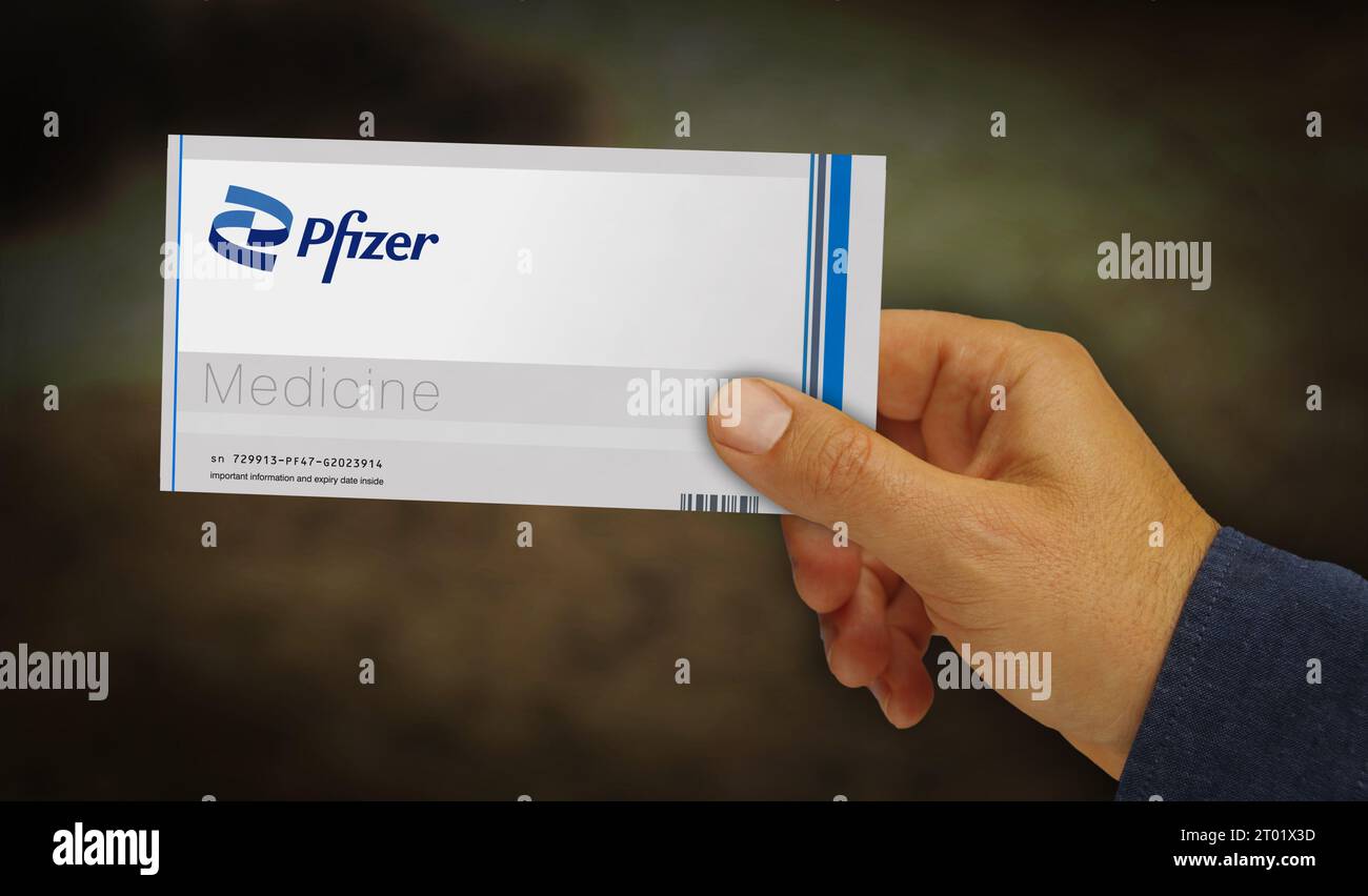Poznan, Poland, October 2, 2023: Pfizer tablets box in hand ...