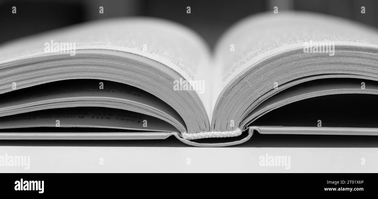 Open book close up. One book is yellow Stock Photo - Alamy