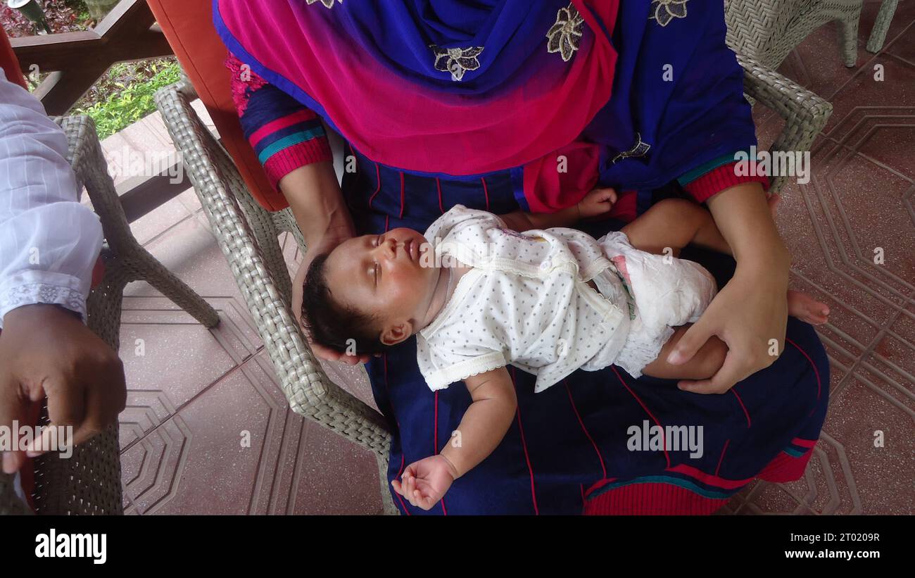 3 October 2023 Dhaka, Bangladesh. The newborn baby is sleeping Stock Photo - Alamy