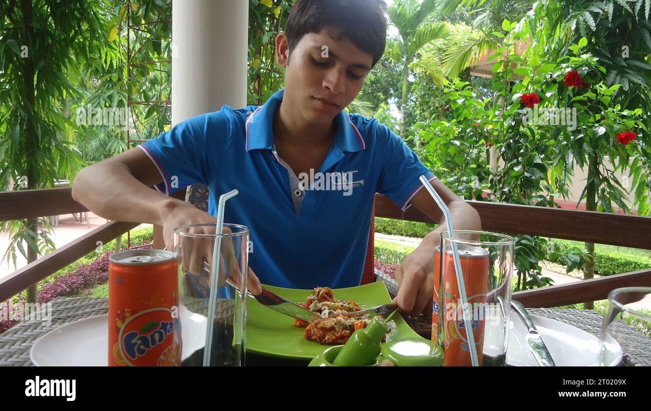 3 October 2023 Dhaka, Bangladesh. A young boy Stock Photo - Alamy