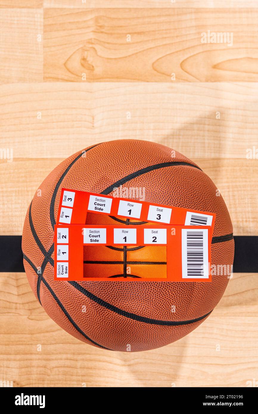 A high view looking down at a pair of ticket stubs to courtside seats ...