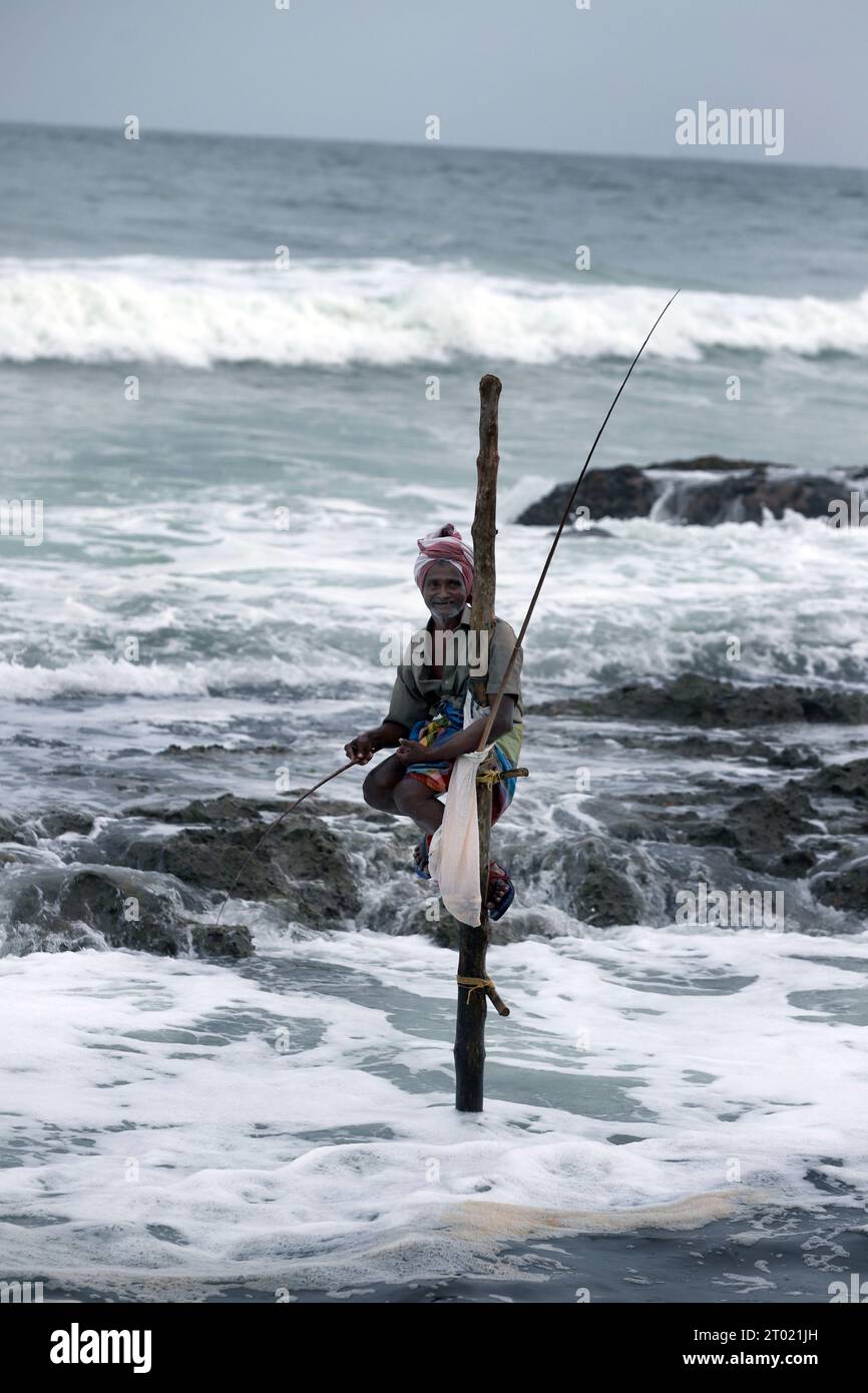 Galle, Sri Lanka. 3rd Oct, 2023. A Sri Lankan stilt fisherman is seen ...