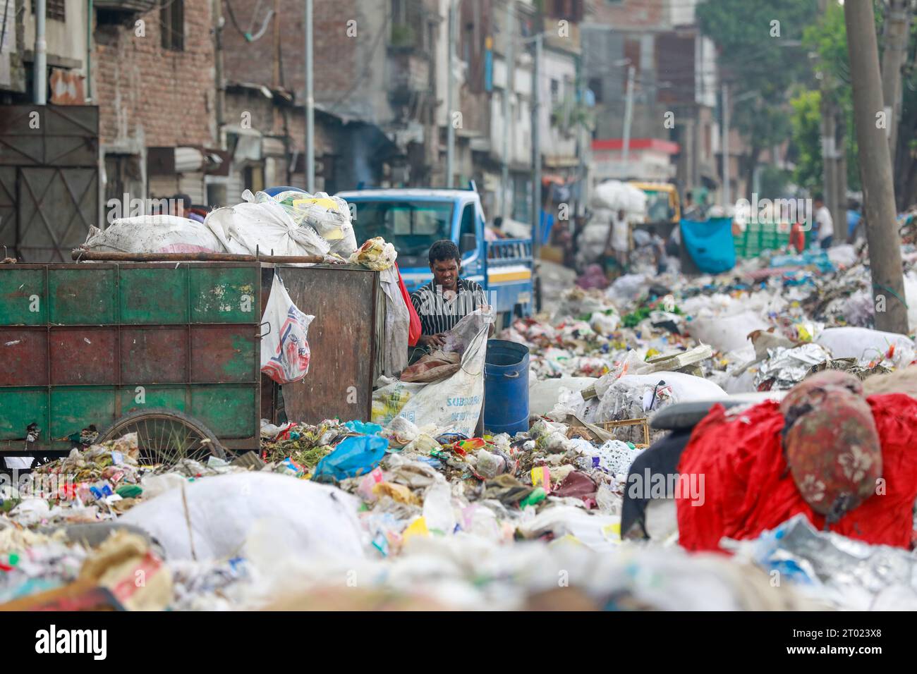 October 2, 2023, Dhaka, Bangladesh: A garbage dumping yard on the bank ...