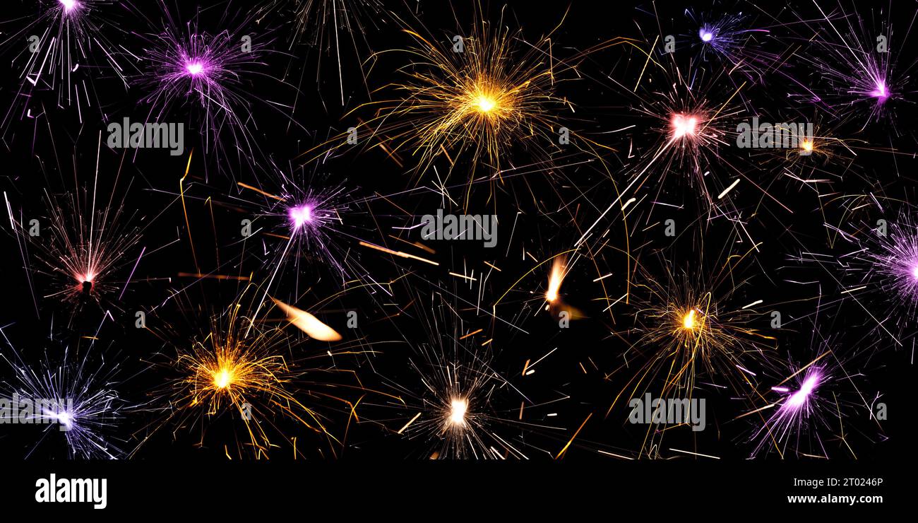 Banner with sparkling multi-colored burning sparklers, flares, sparks ...