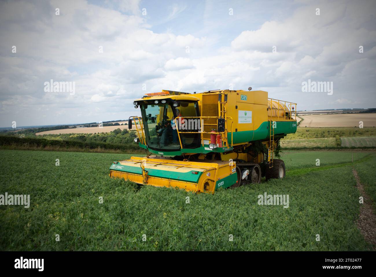A pea harvester at The Green Pea Company harvest peas in fields near ...