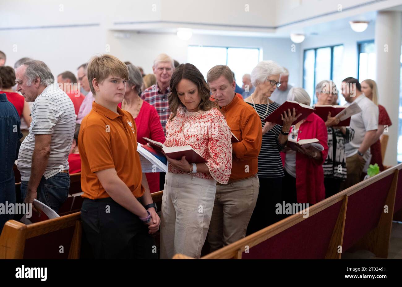 Austin Texas USA, October 1 2023: Congregation members sand in pews ...