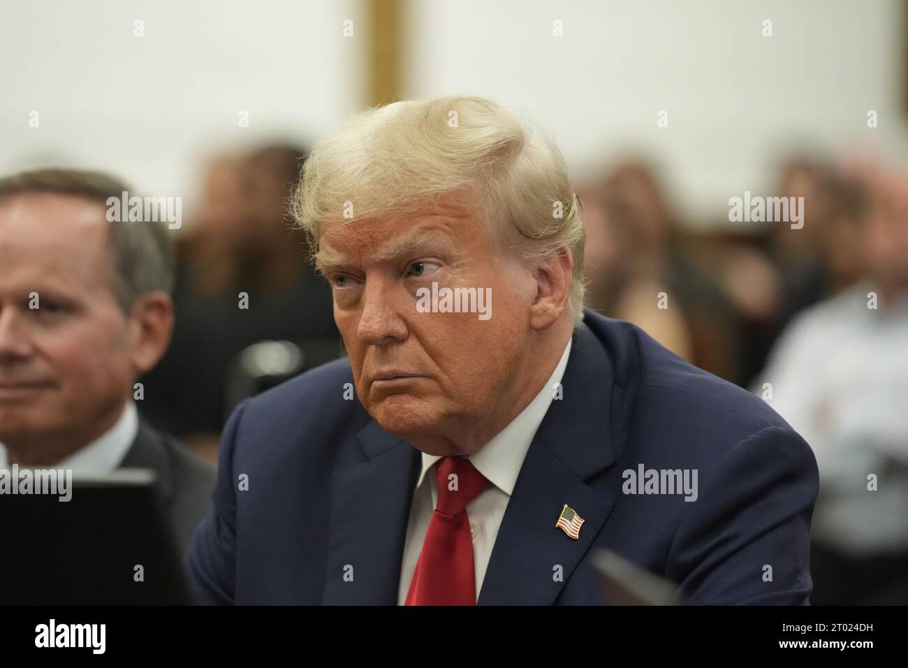 New York, USA. 03rd Oct, 2023. Former President Donald Trump sits in ...