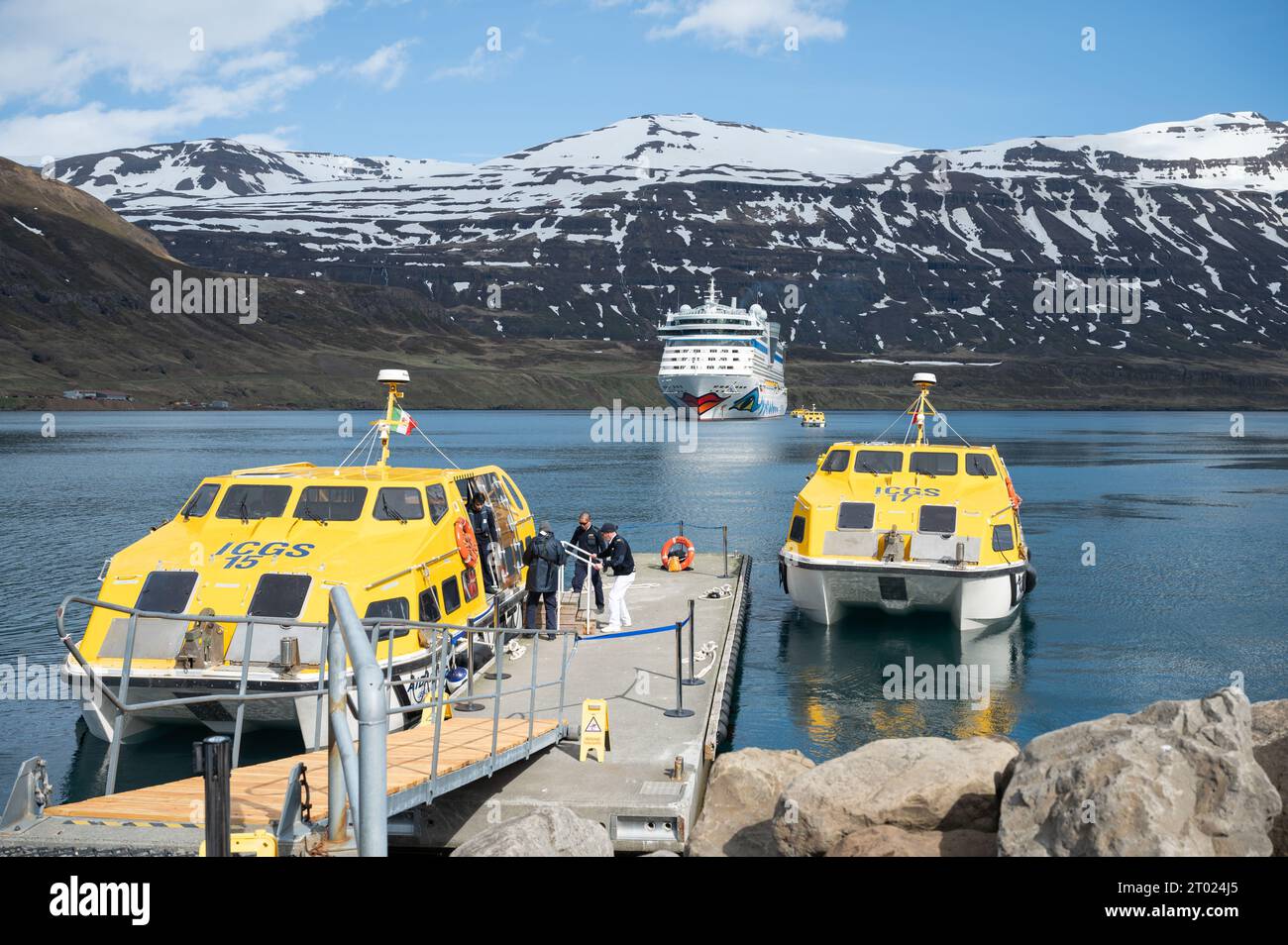 AIDA Bella at the Fjord of Seydisfjordur with two yellow lifeboat in ...