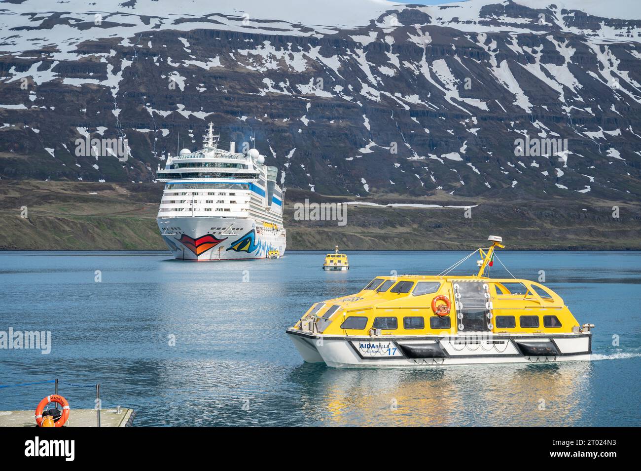 AIDA Bella at the Fjord of Seydisfjordur with two yellow lifeboat in ...