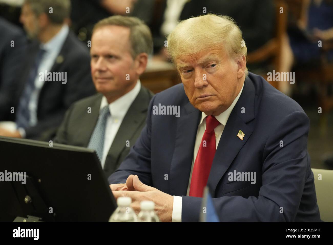 New York, USA. 03rd Oct, 2023. Former President Donald Trump sits in ...