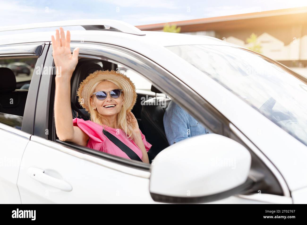 Family waving from window hi-res stock photography and images - Alamy