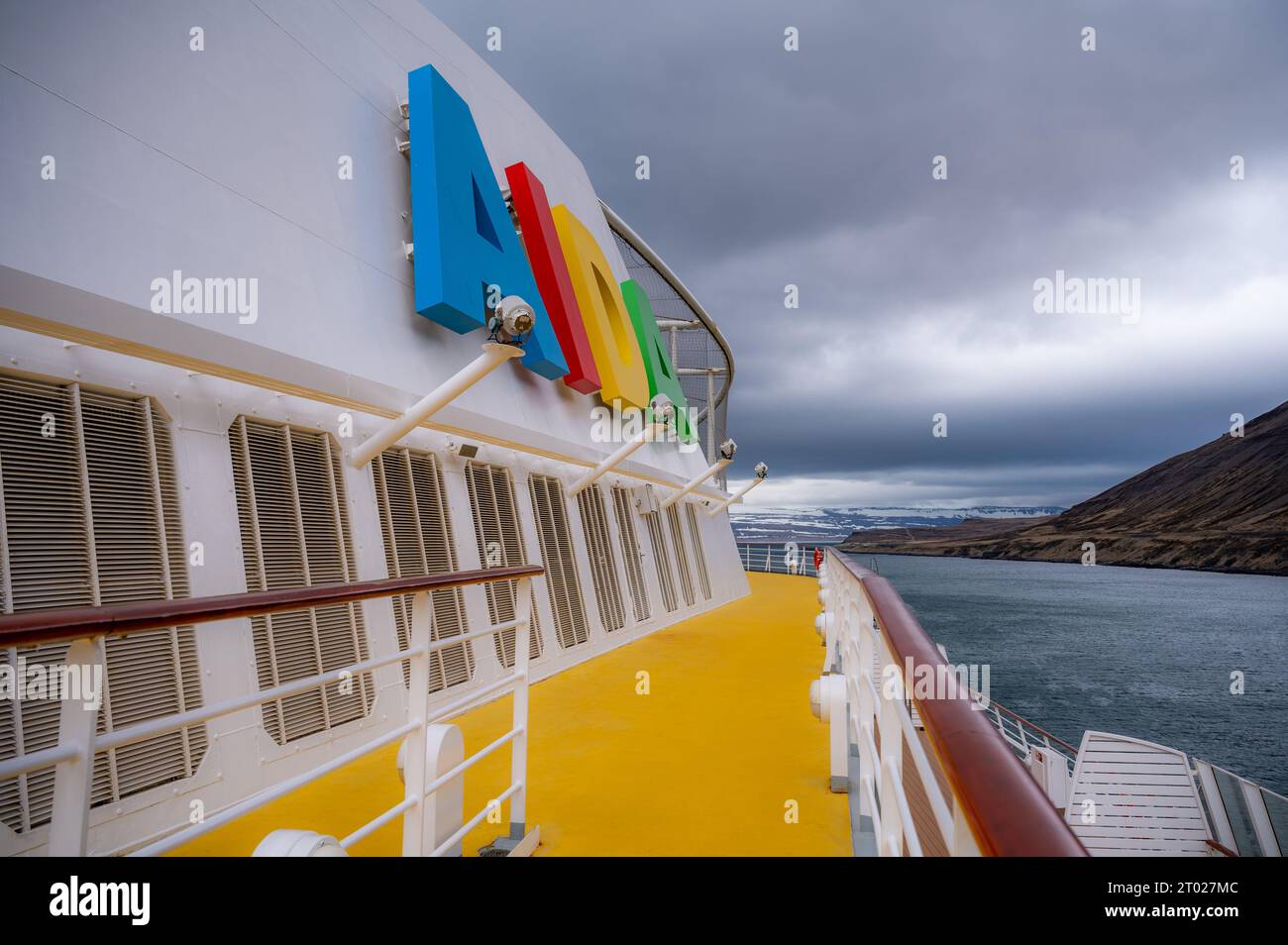 AIDA Logo at AIDA Bella cruise ship during cloudy day with boat deck in ...