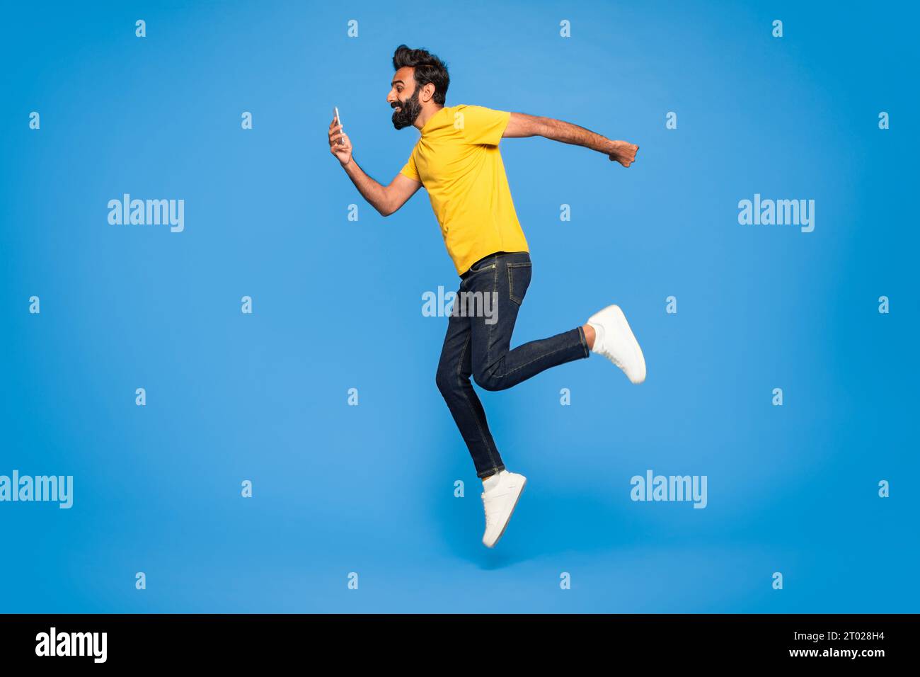 Amazing deal concept. Excited indian man running and looking at ...