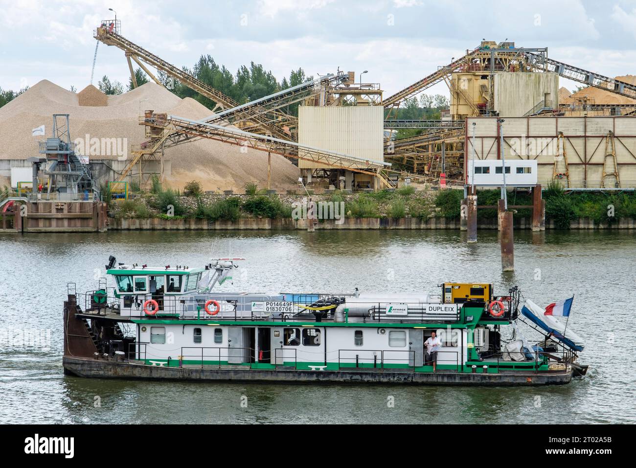 Sand quarry and waterways transportation of the sand. River transport ...