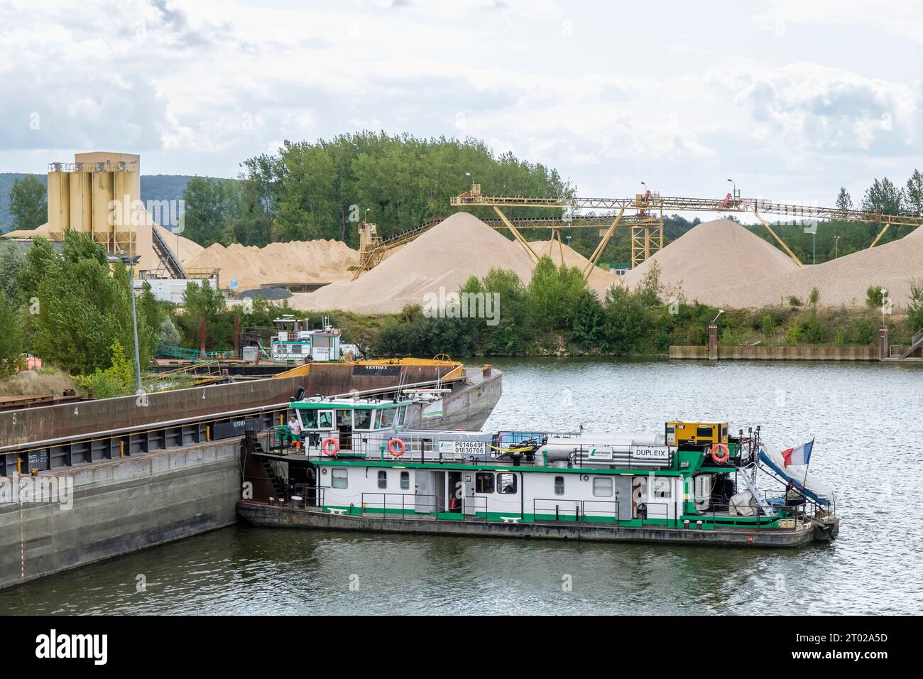 Sand quarry and waterways transportation of the sand. River transport ...