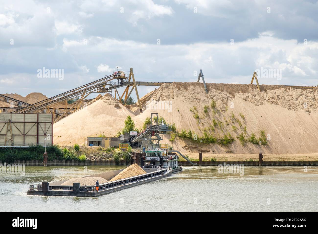 Sand quarry and waterways transportation of the sand. River transport ...
