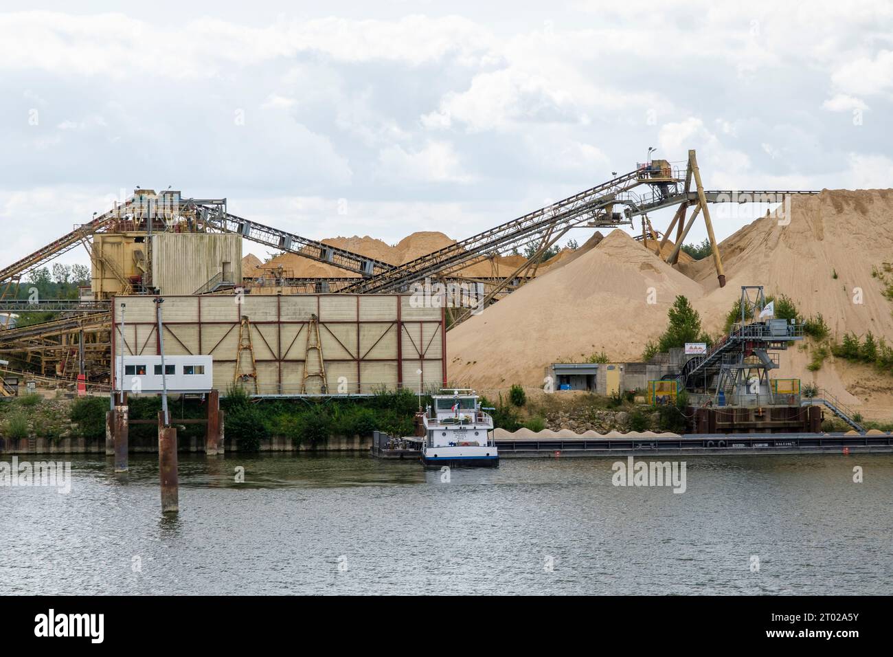 Sand quarry and waterways transportation of the sand. River transport ...