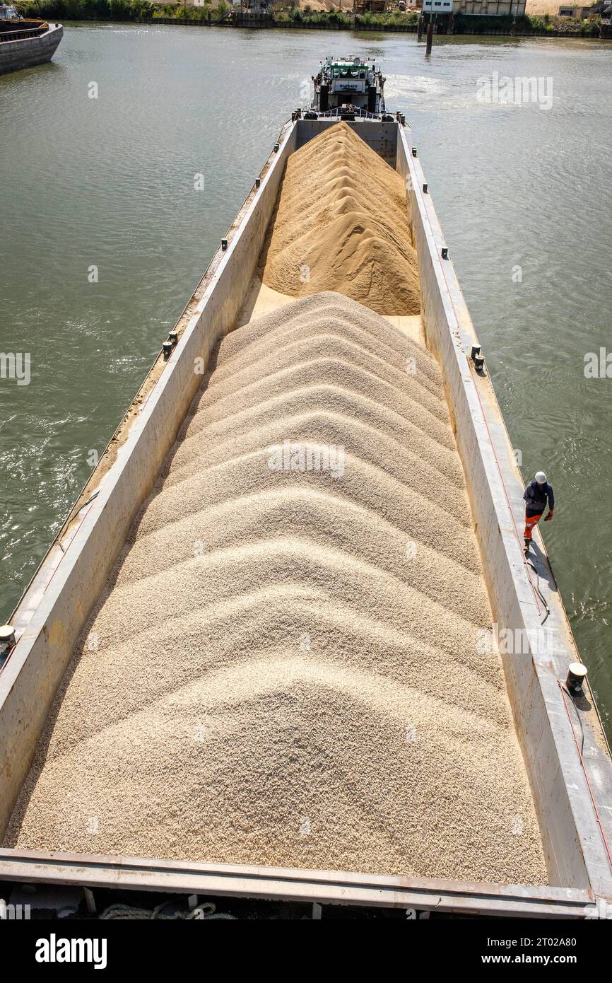 Sand quarry and waterways transportation of the sand. River transport ...