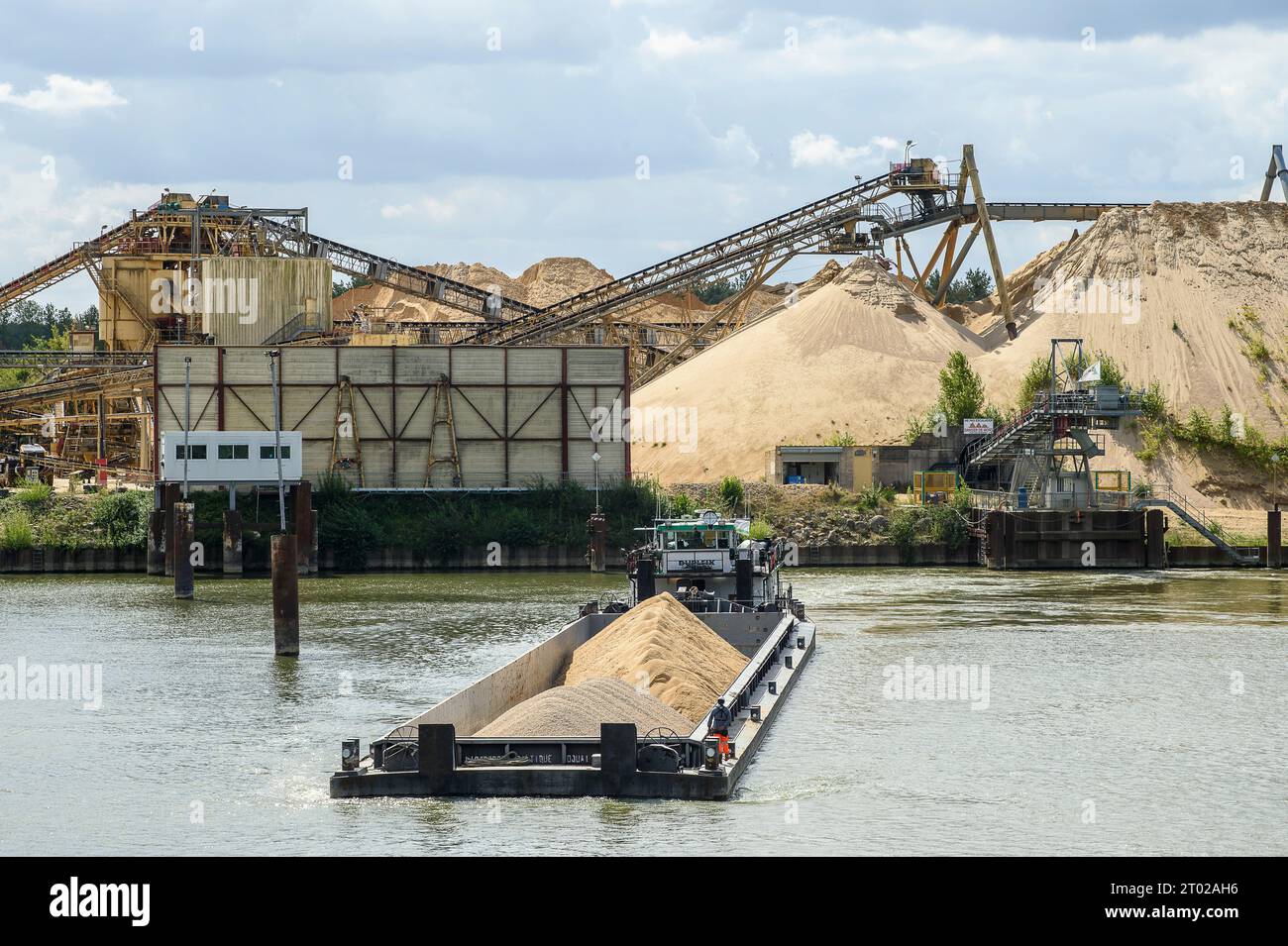 Sand quarry and waterways transportation of the sand. River transport ...
