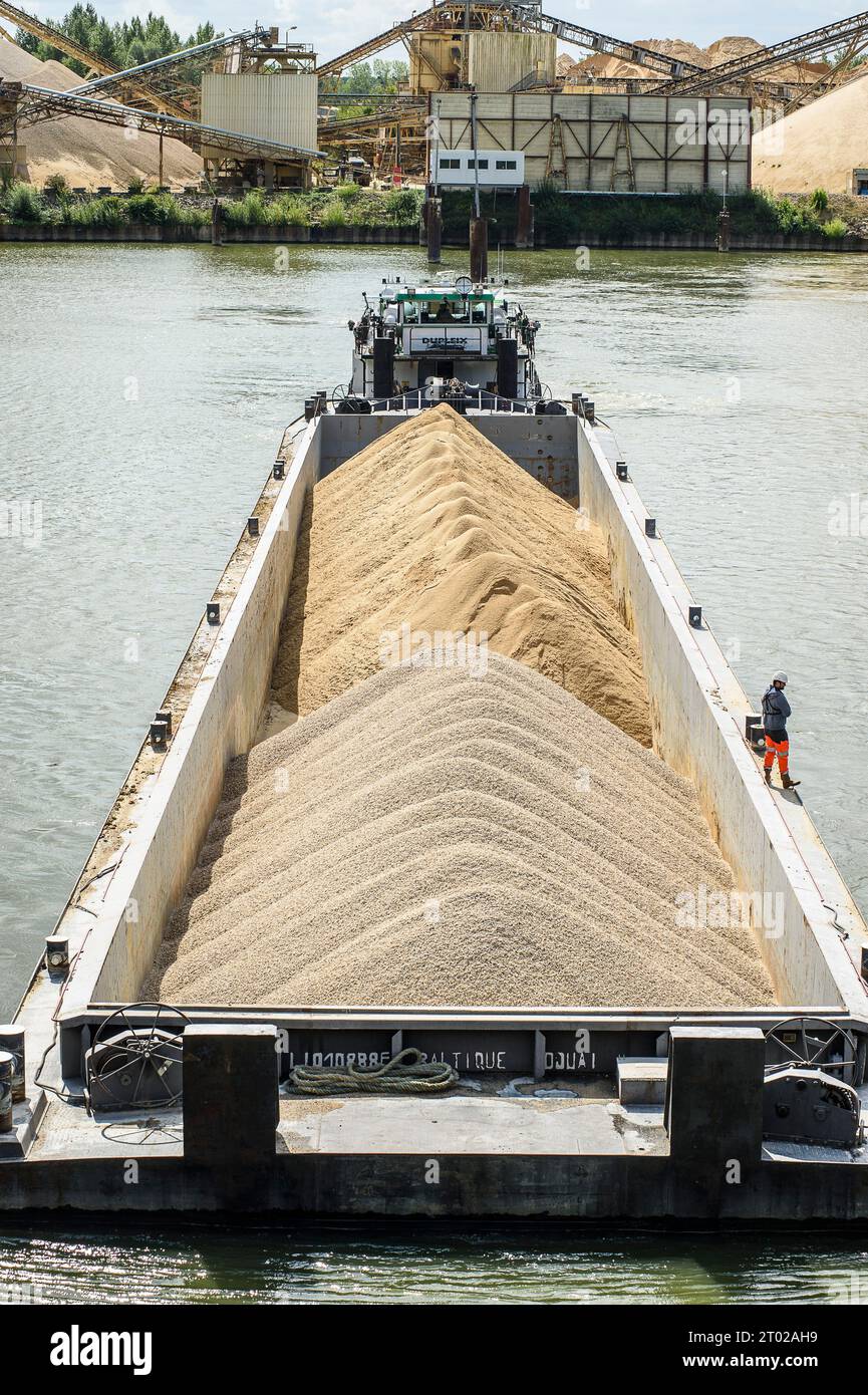Sand quarry and waterways transportation of the sand. River transport ...