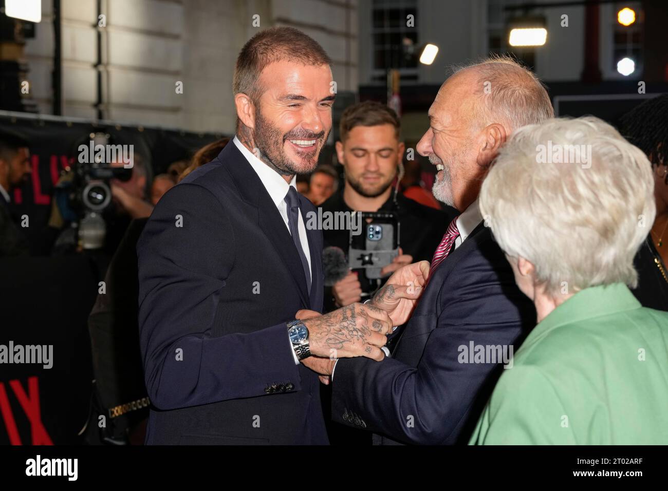 David Beckham, left, adjusts Ted Beckham's tie upon arrival at the ...