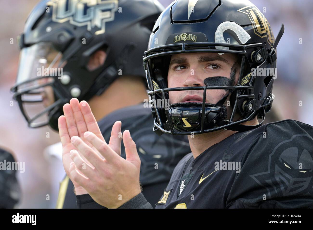Central Florida quarterback John Rhys Plumlee, right, applauds on the ...