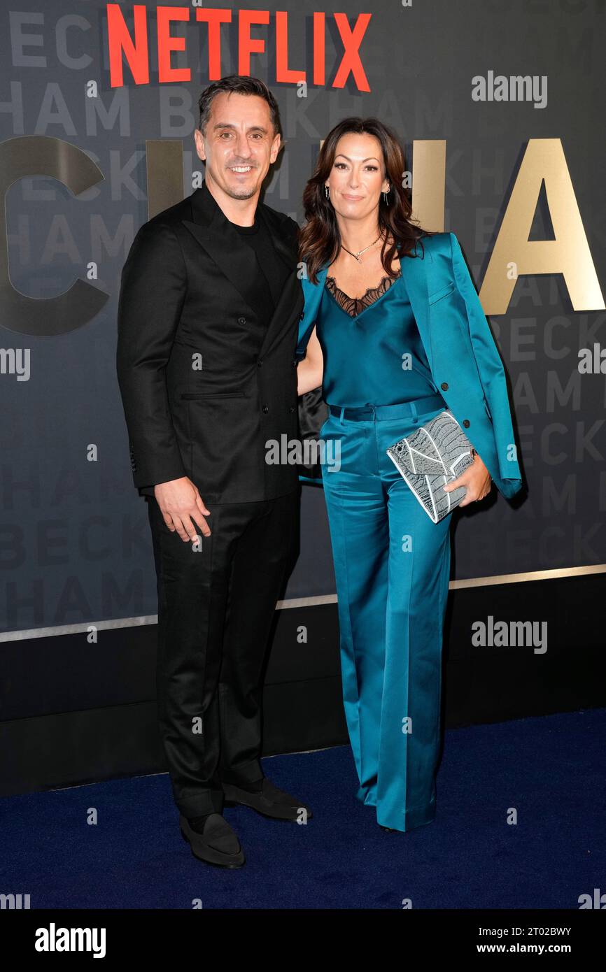 Gary Neville, left, and Emma Hadfield pose for photographers upon ...