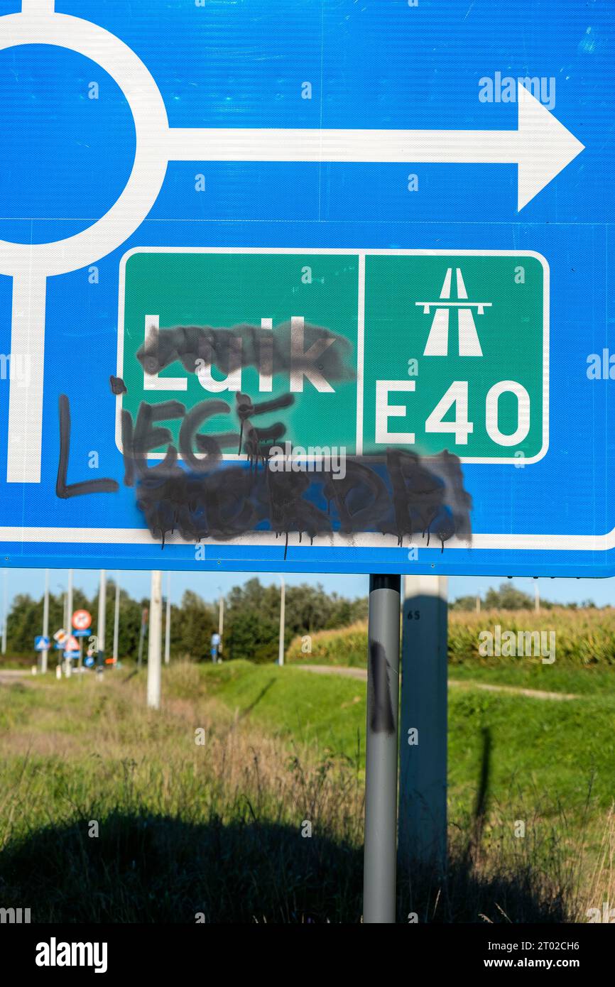 Regional road sign in flemish with direction arrow to Liege ...