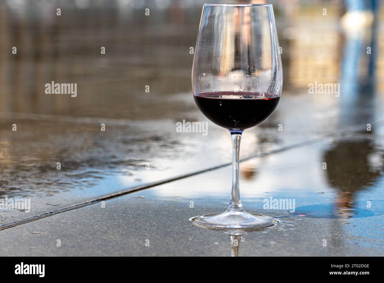 Tasting of Bordeaux blended red wine and view on city Bordeaux on ...
