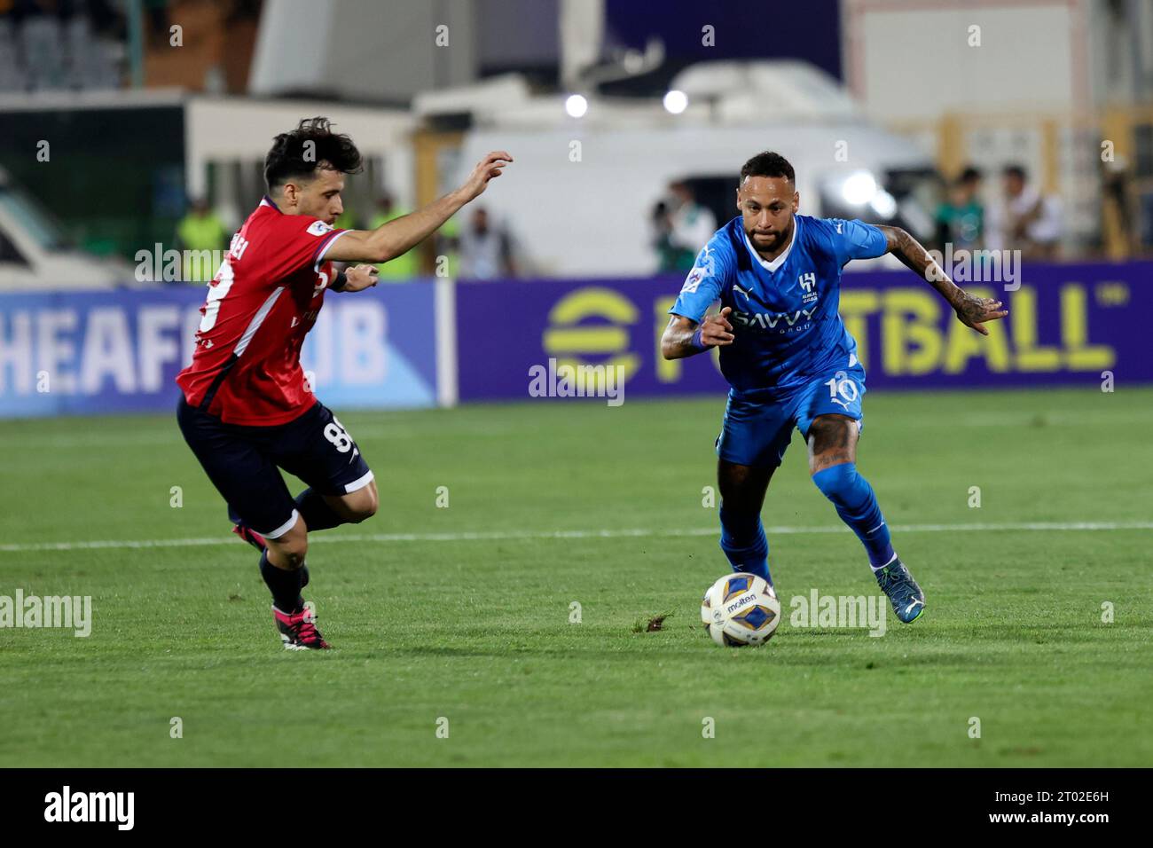 Al Hilal's Neymar, right, and FC Nassaji Mazandaran's Esmaeil Babaei, left, challenge for the ...