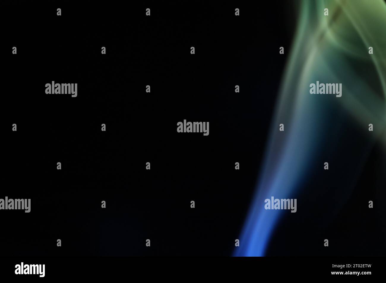 Yellow and blue smoke on a dark background, colourful abstract, blue ...