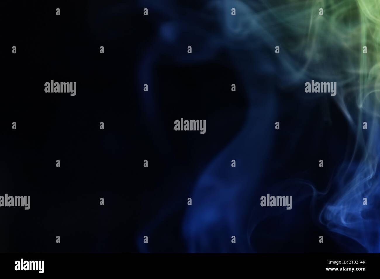 Yellow and blue smoke on a dark background, colourful abstract Stock ...