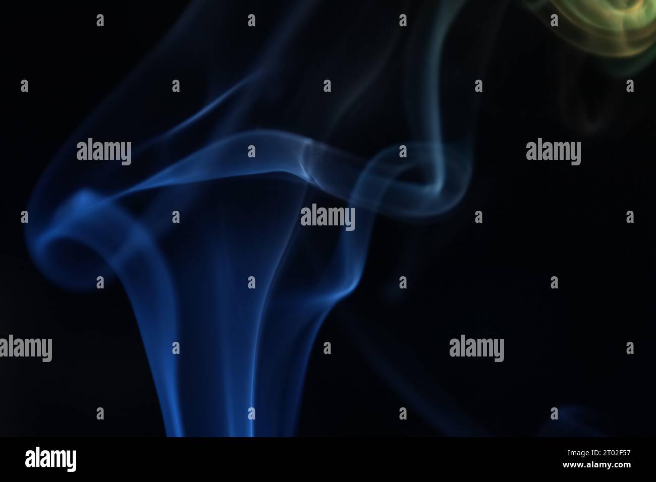 Yellow and blue smoke on a dark background, colourful abstract Stock ...
