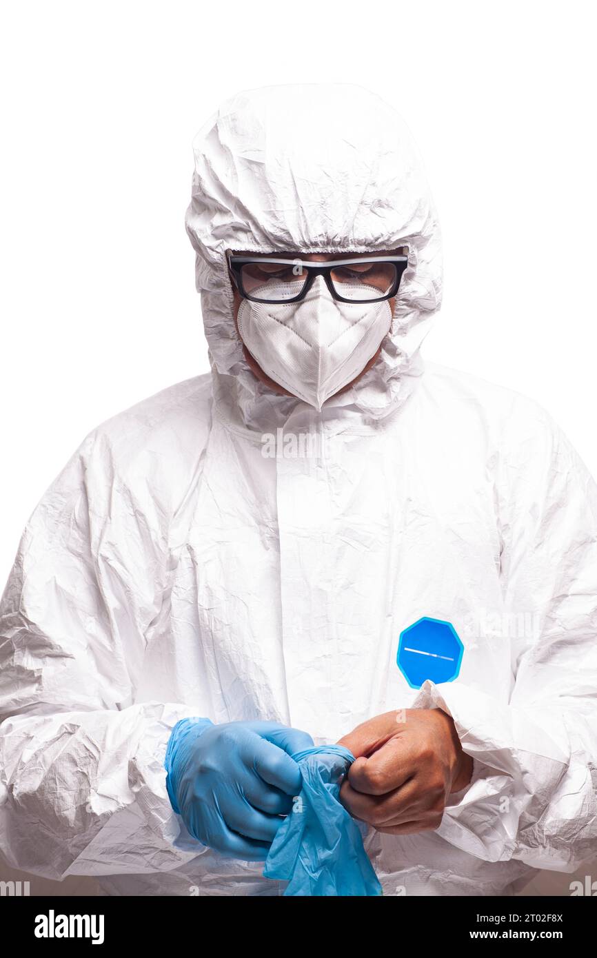 Doctor scientist in white coverall suit, mask and glasses wears blue ...