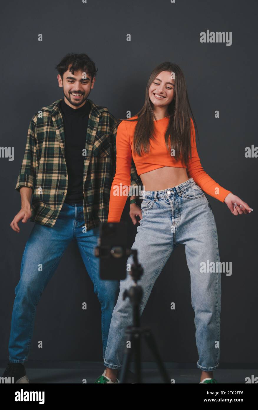 Cheerful millennial caucasian couple having fun together, dancing ...