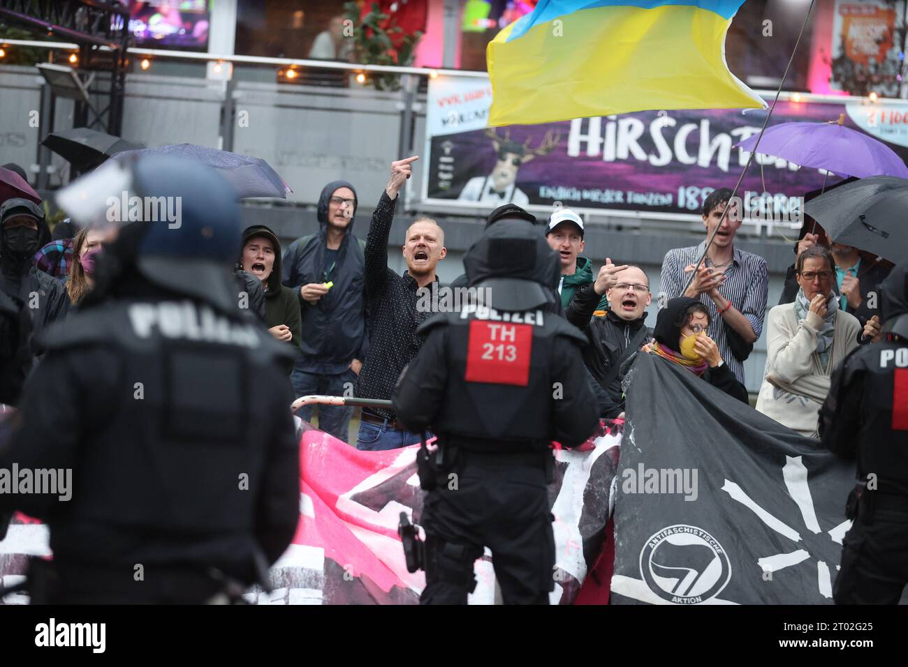 Gera, Germany. 03rd Oct, 2023. Left-wing demonstrators protest against ...