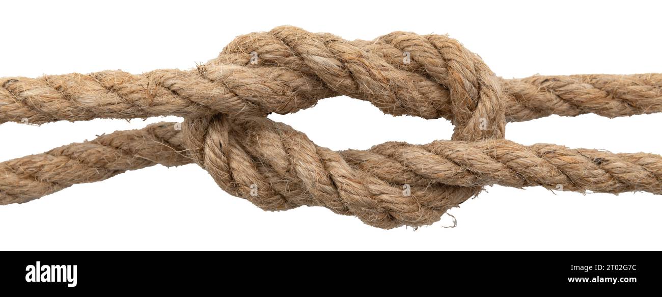 Rope made of jute in loops and knots on a white background. Linen ...