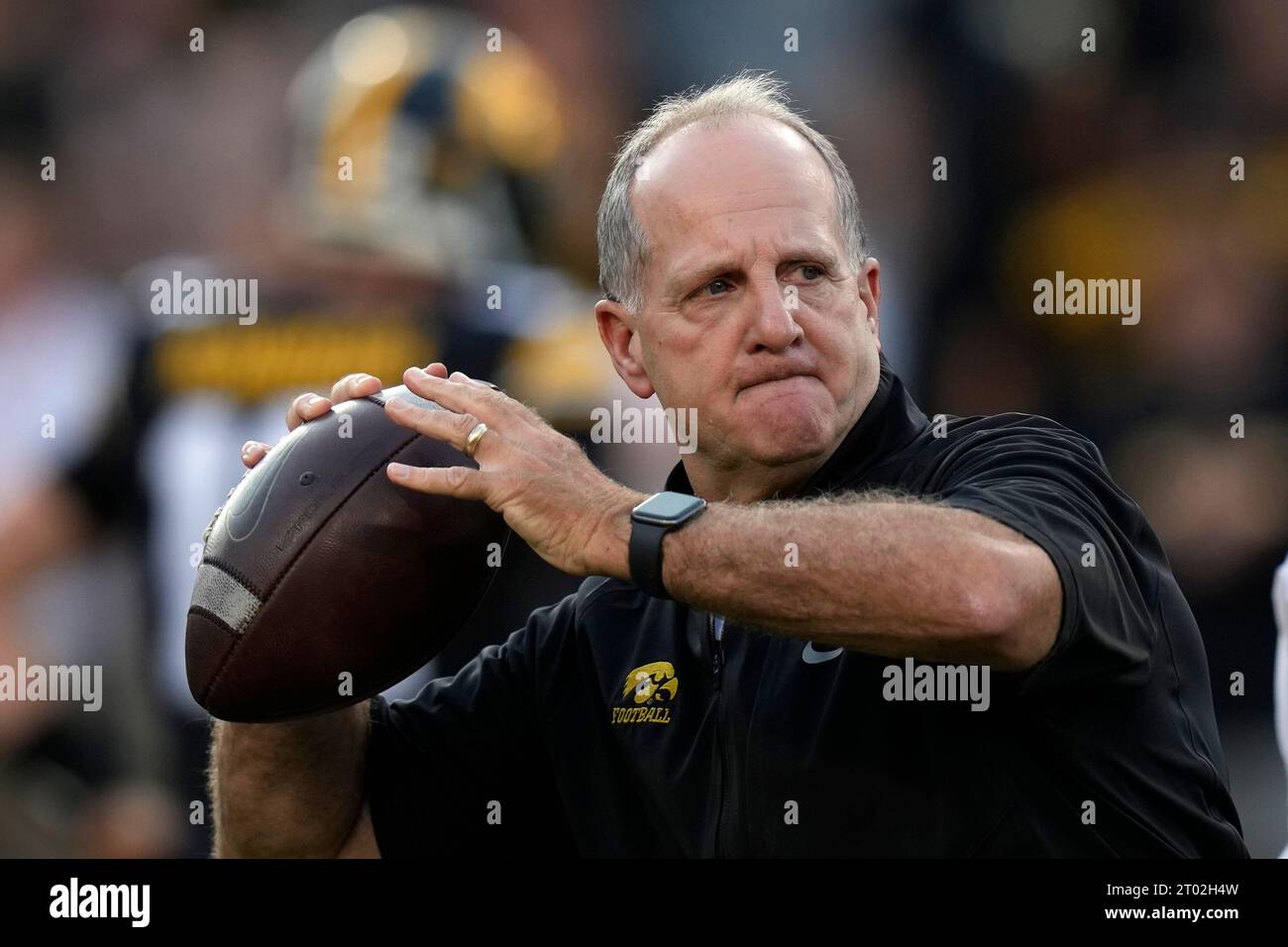 Iowa defensive coordinator Phil Parker throws a football before an NCAA ...