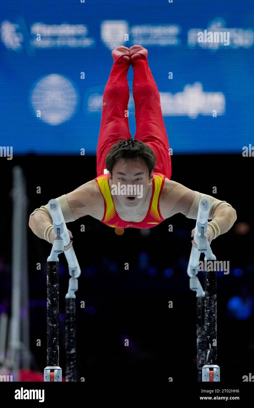 China's Sun Wei competes on the parallel bars during the Artistic ...
