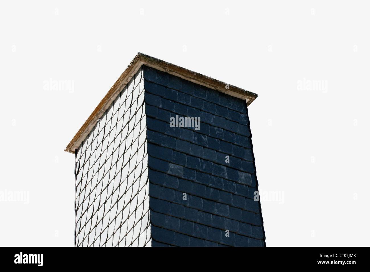 clad in slate shingles chimney, with blue sky in background Stock Photo ...