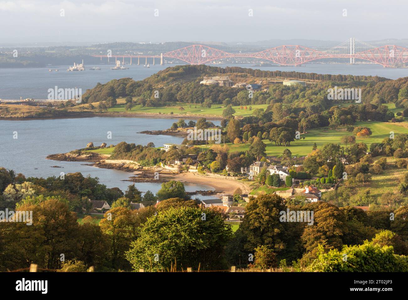 The picturesque village of Aberdour in Fife with the Forth Bridges in ...