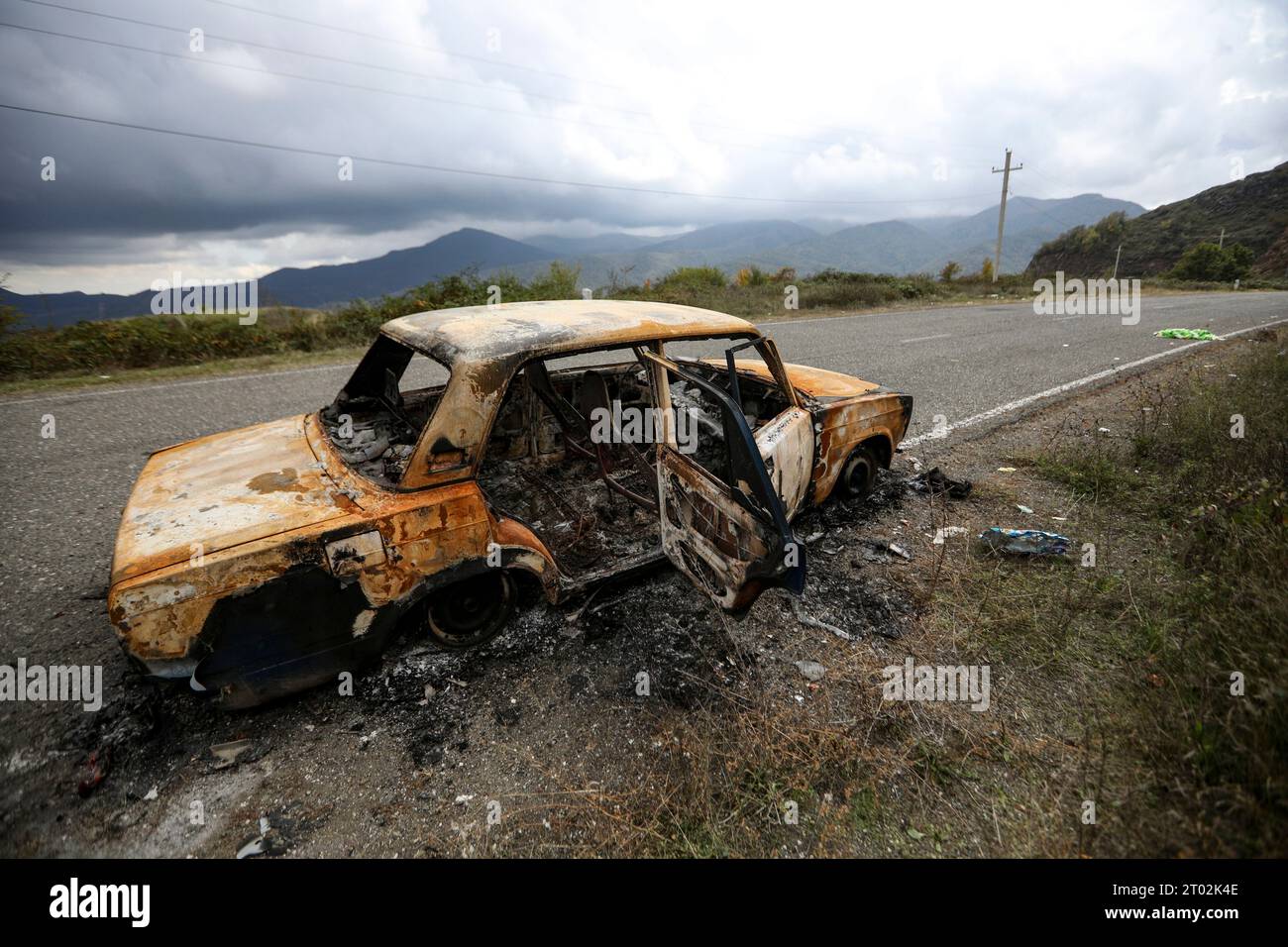 A burned Armenian car is seen on the road on Tuesday, Oct. 3, 2023 ...