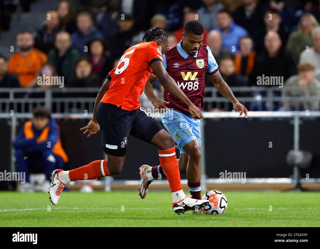 Luton Town's Teden Mengi (left) and Burnley's Lyle Foster battle for ...