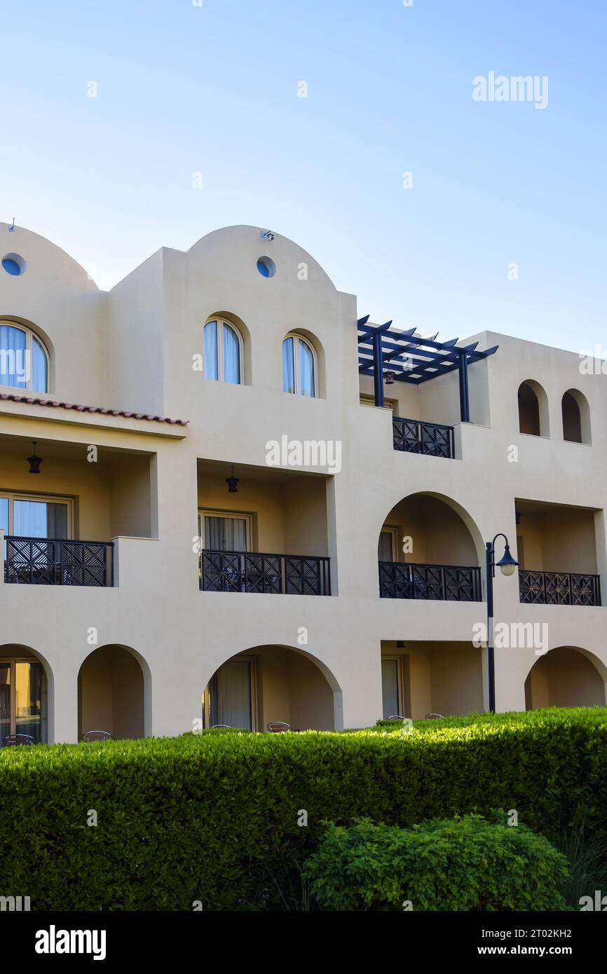 Architecture of buildings is in Arabic style. An arch windows in wall ...