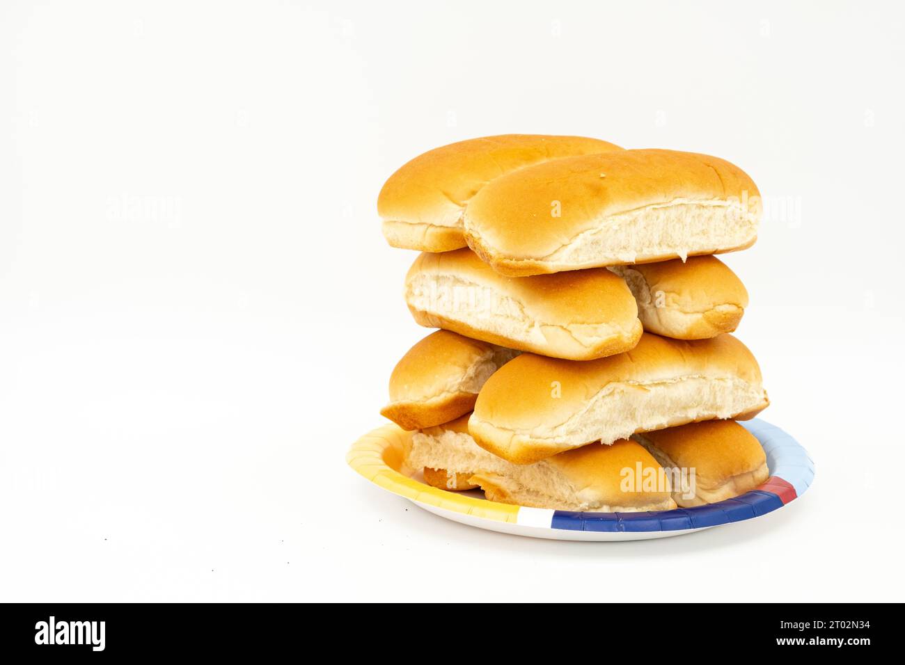 Hot dog buns stacked up in pairs on paper plate ready to add hot dogs ...