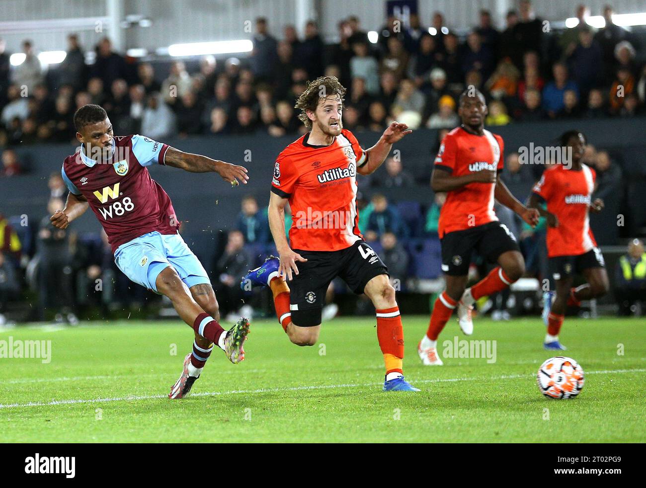 Burnley's Lyle Foster (left) scores their side's first goal of the game ...