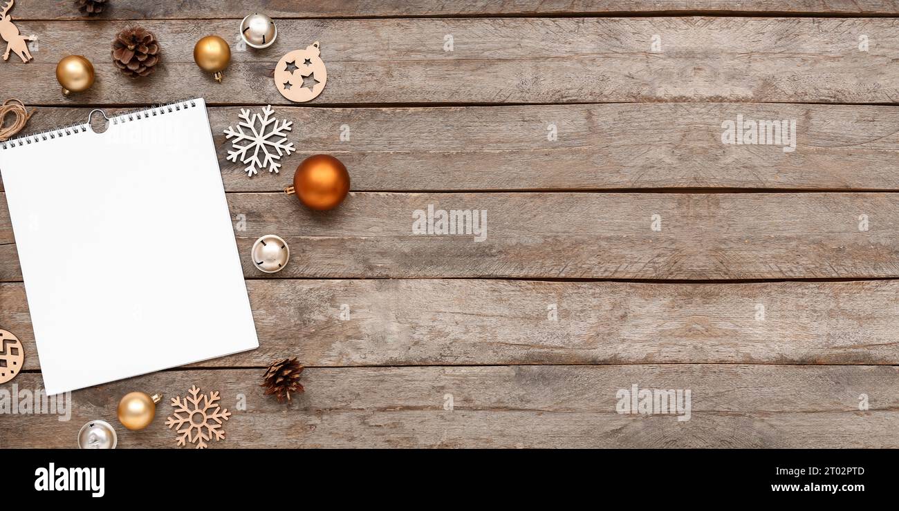 Blank calendar with Christmas decor on wooden background with space for ...